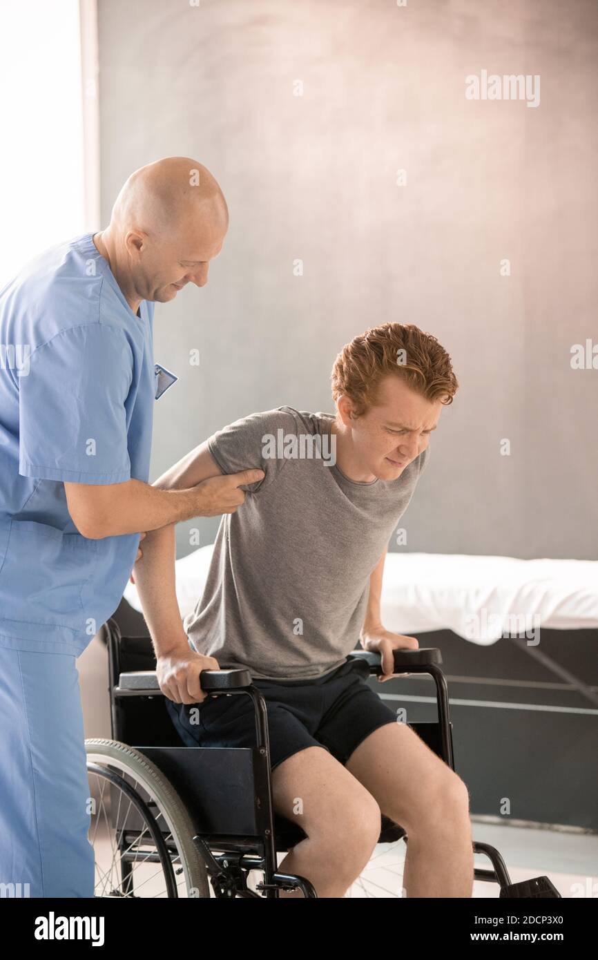 Sick man in a wheelchair hi-res stock photography and images - Alamy