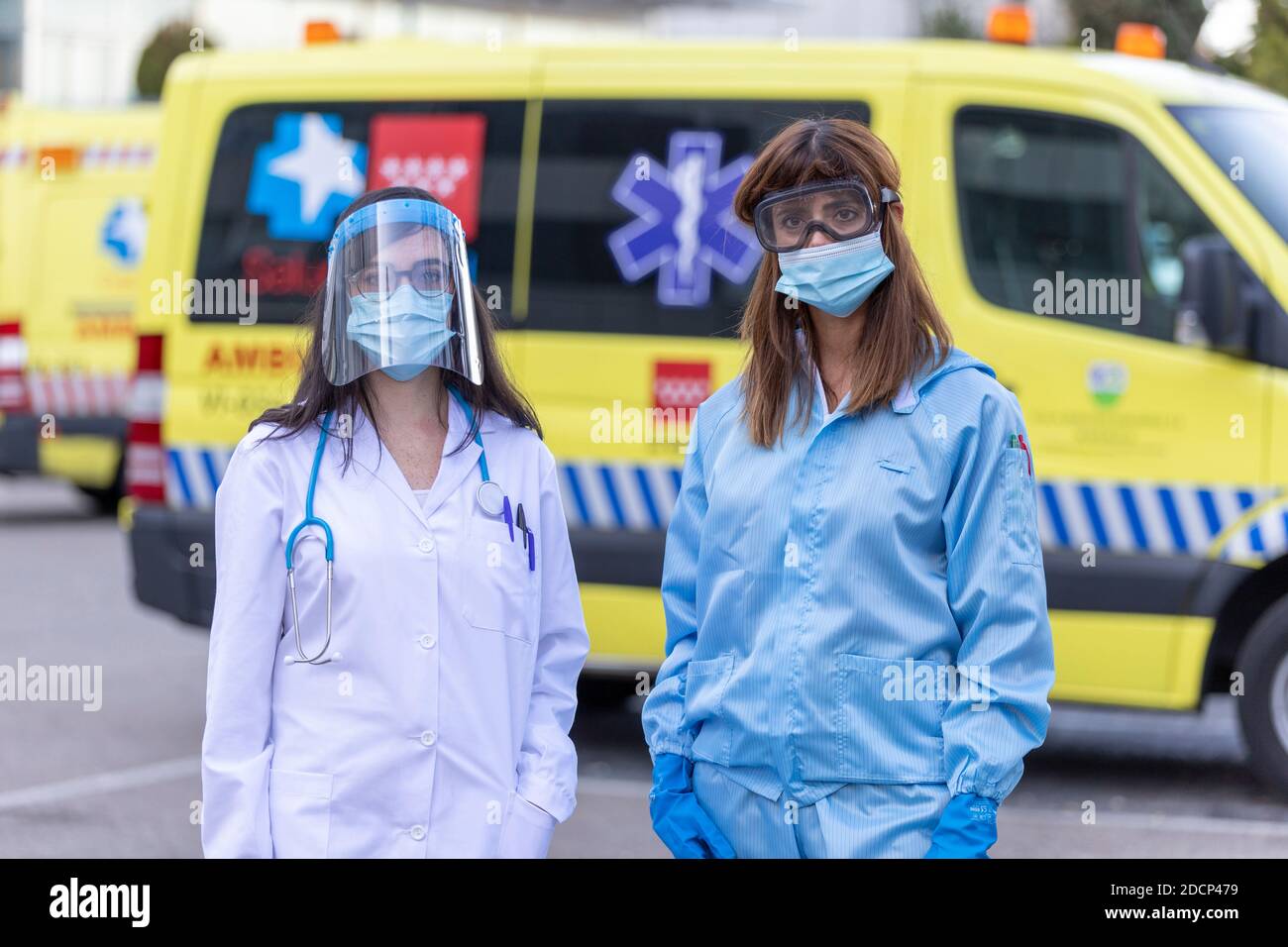 Couple of doctors working at the emergency door of the hospital ...