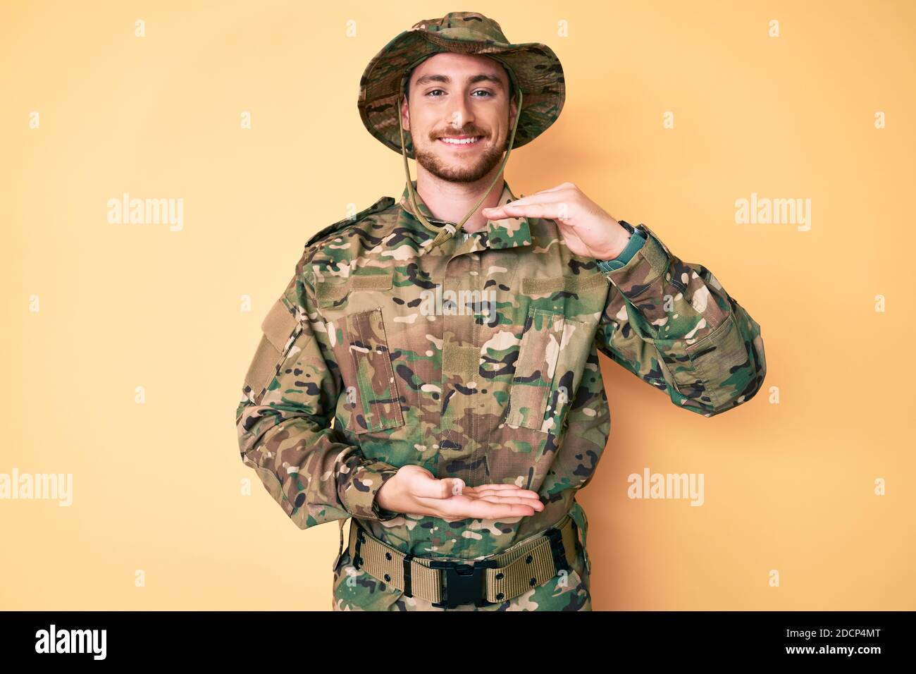 Young caucasian man wearing camouflage army uniform gesturing with ...