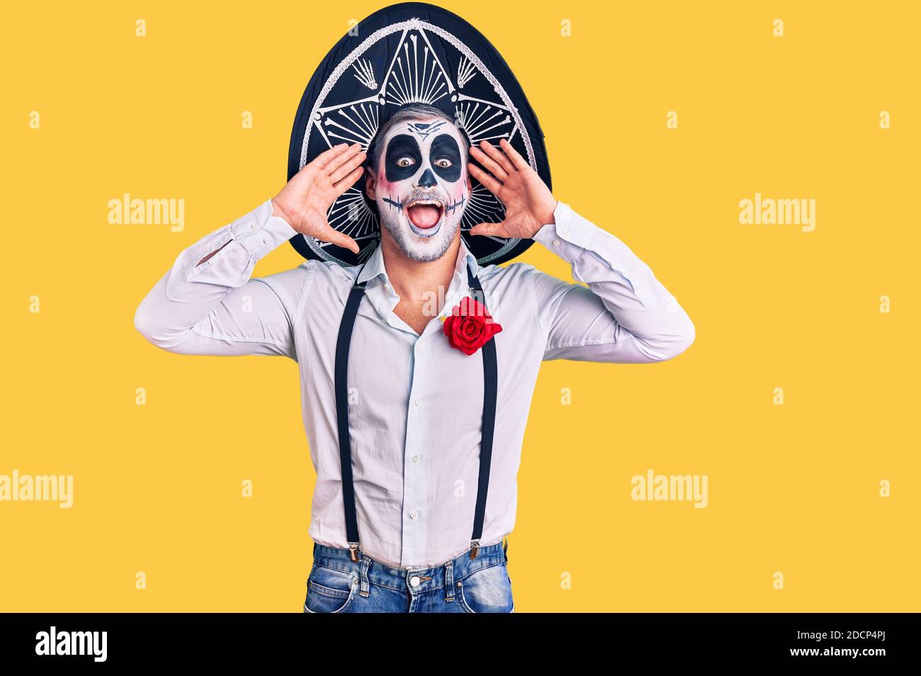 Man wearing day of the dead costume over background crazy and scared ...