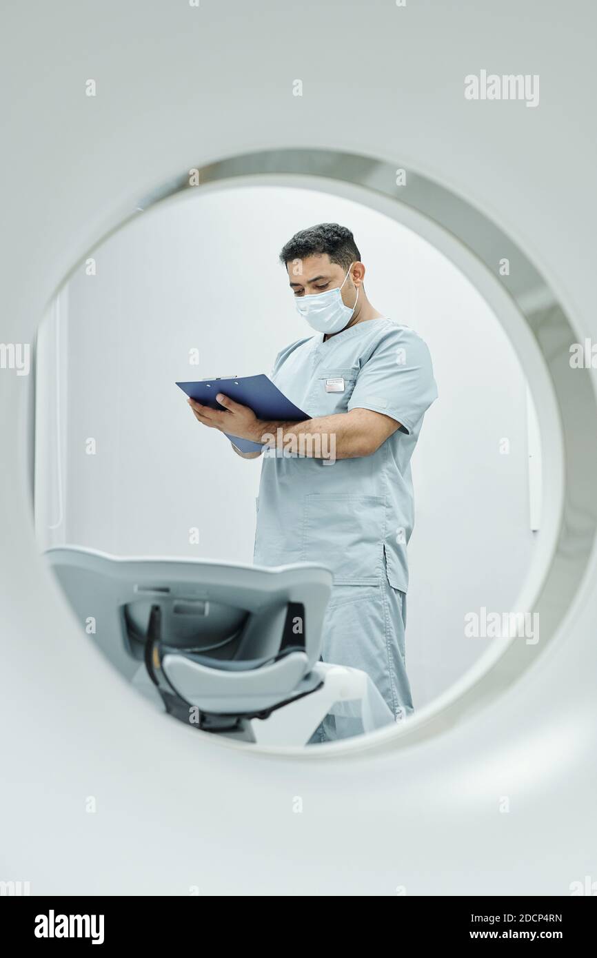 Standing examining holding uniform hi-res stock photography and images ...