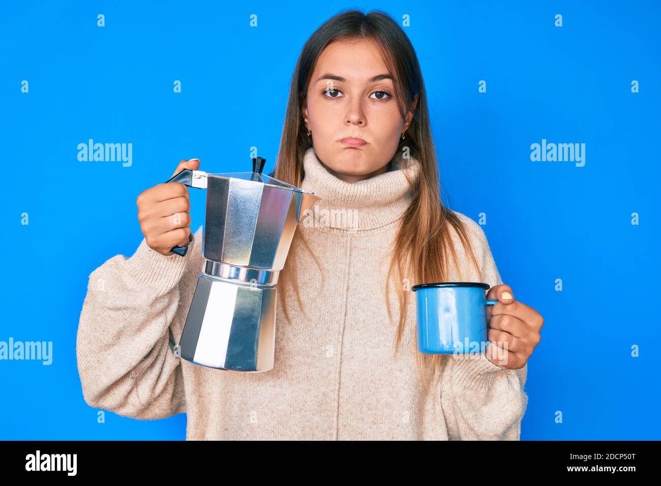 Beautiful caucasian woman drinking italian coffee depressed and worry ...