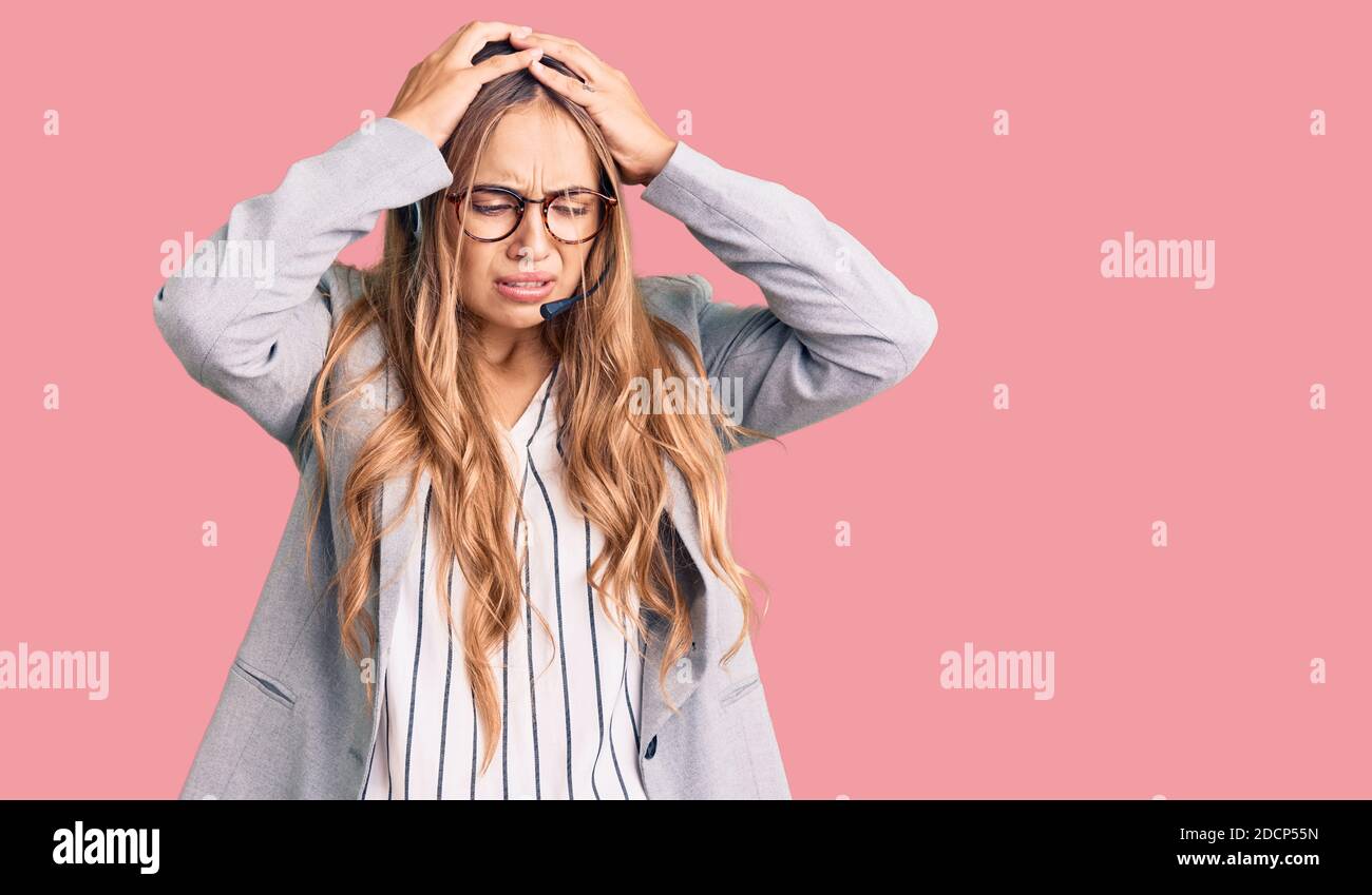 Young beautiful blonde woman wearing call center agent headset ...