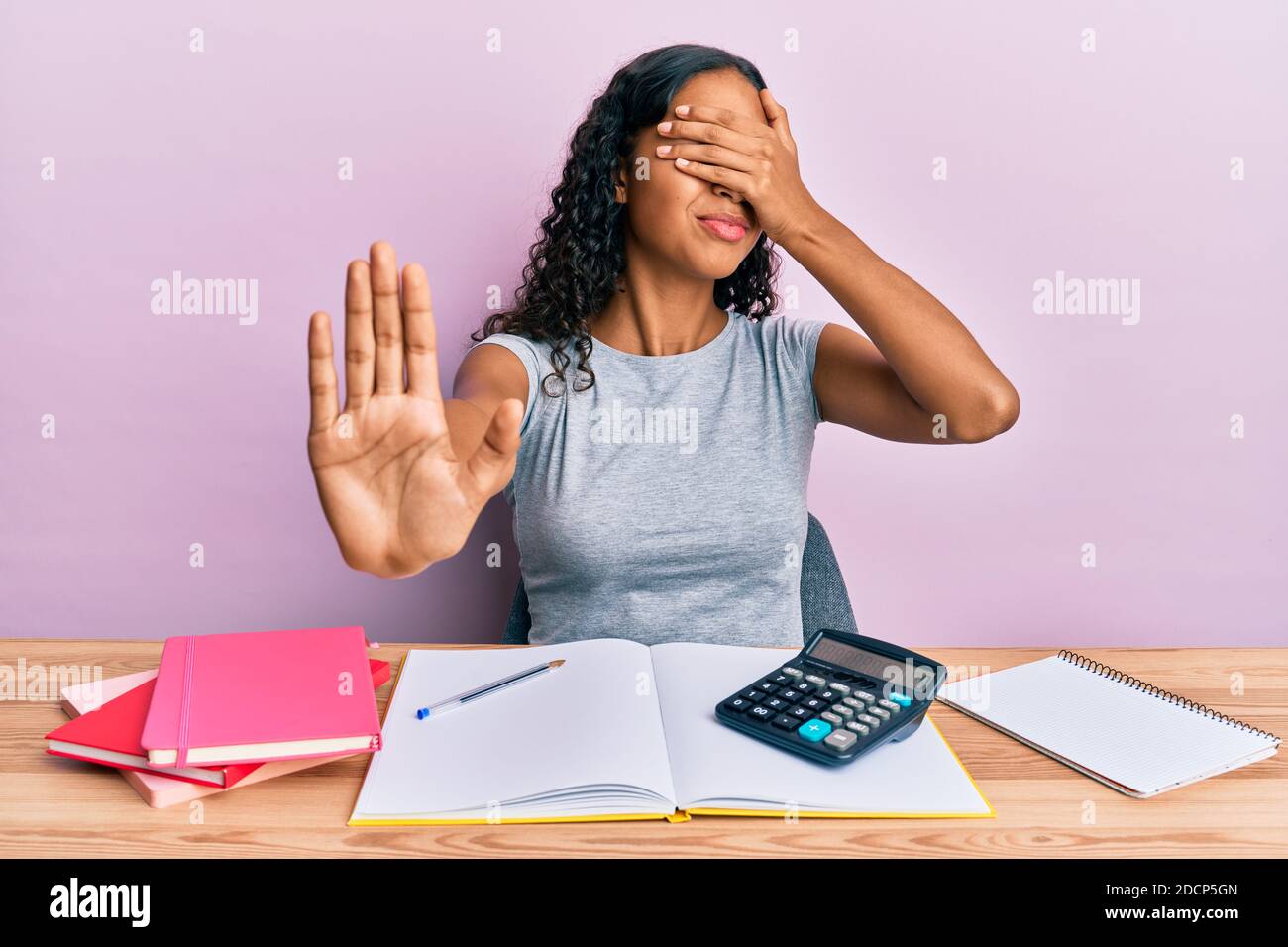 Young african american girl accountant working at the office covering ...