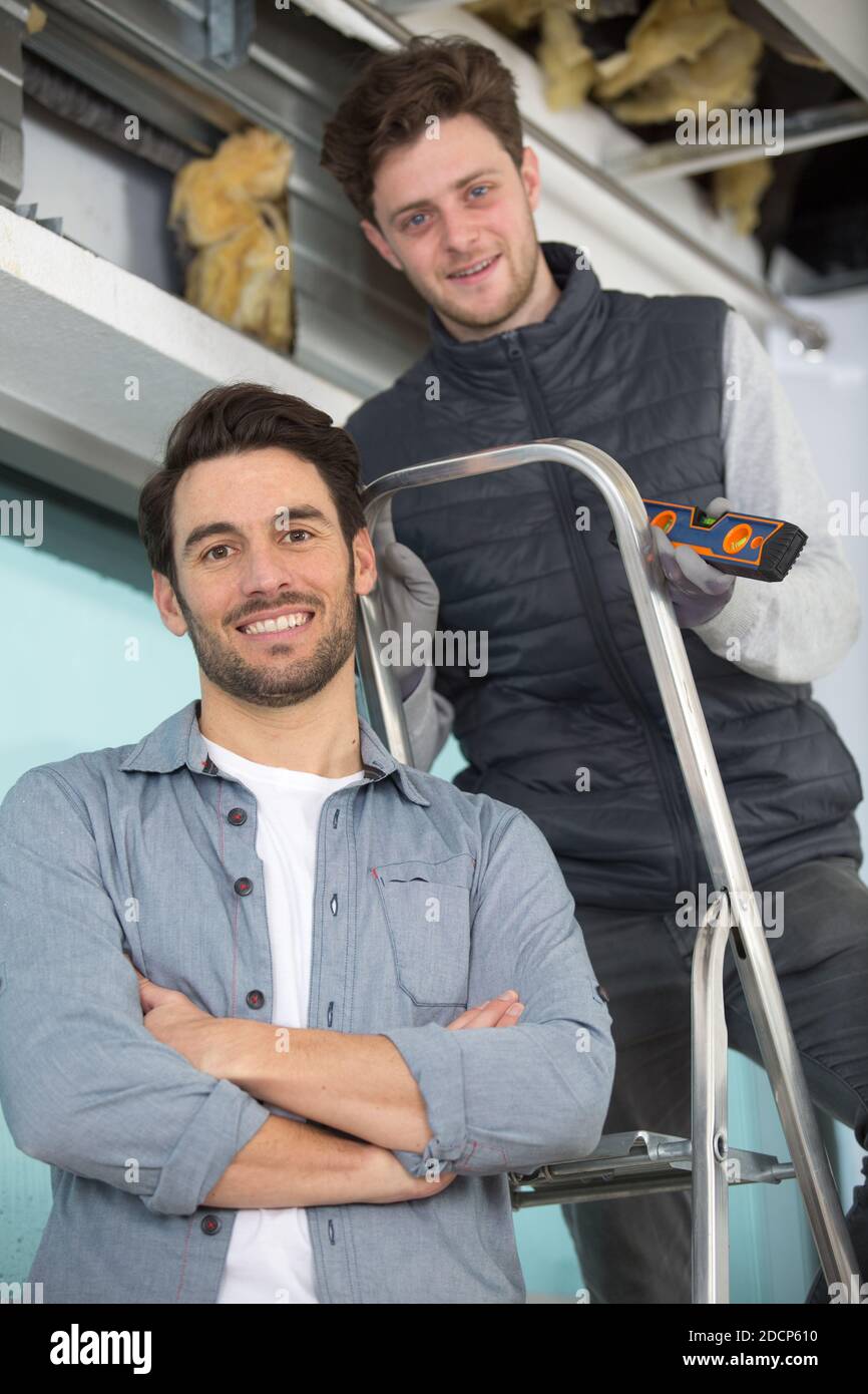 male workers looking at the camera Stock Photo - Alamy