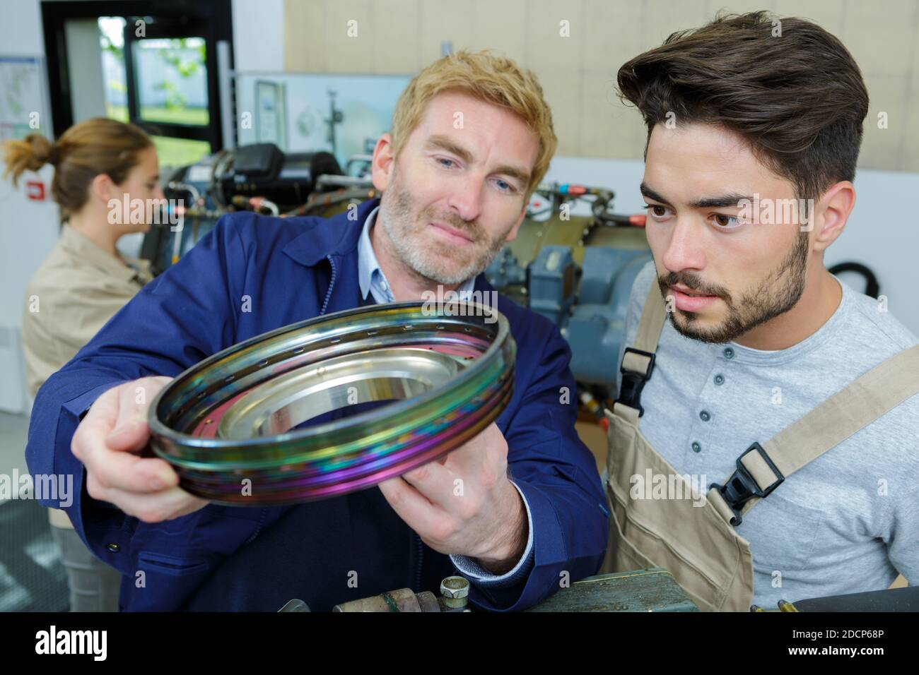 man showing equipment to trainee Stock Photo - Alamy