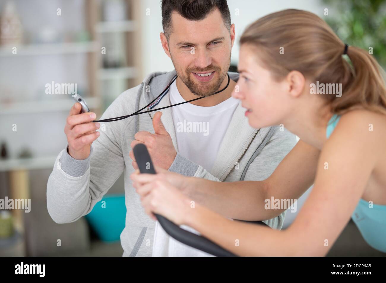 professional fitness coach with beautiful woman Stock Photo - Alamy