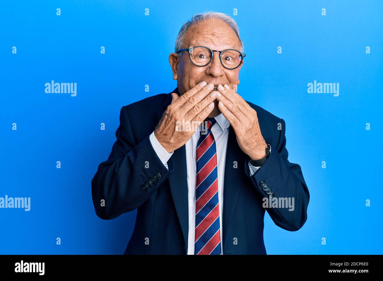 Senior caucasian man wearing business suit and tie laughing and ...