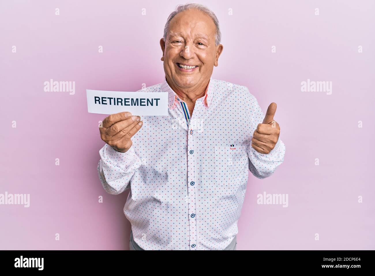 Senior caucasian man holding retirement word paper smiling happy and ...
