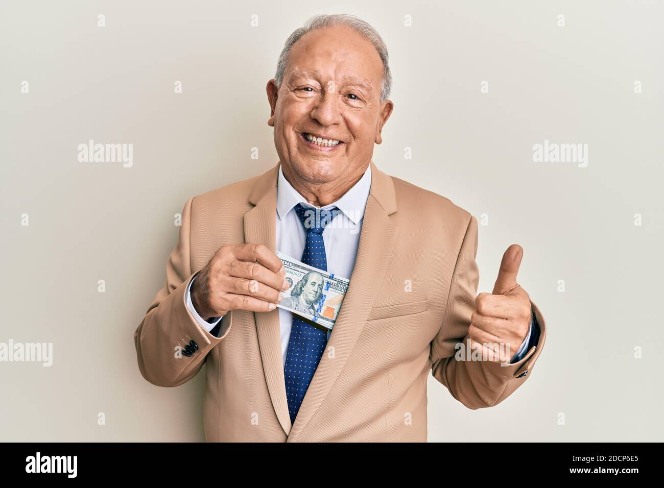 Senior caucasian man saving money bribery smiling happy and positive ...
