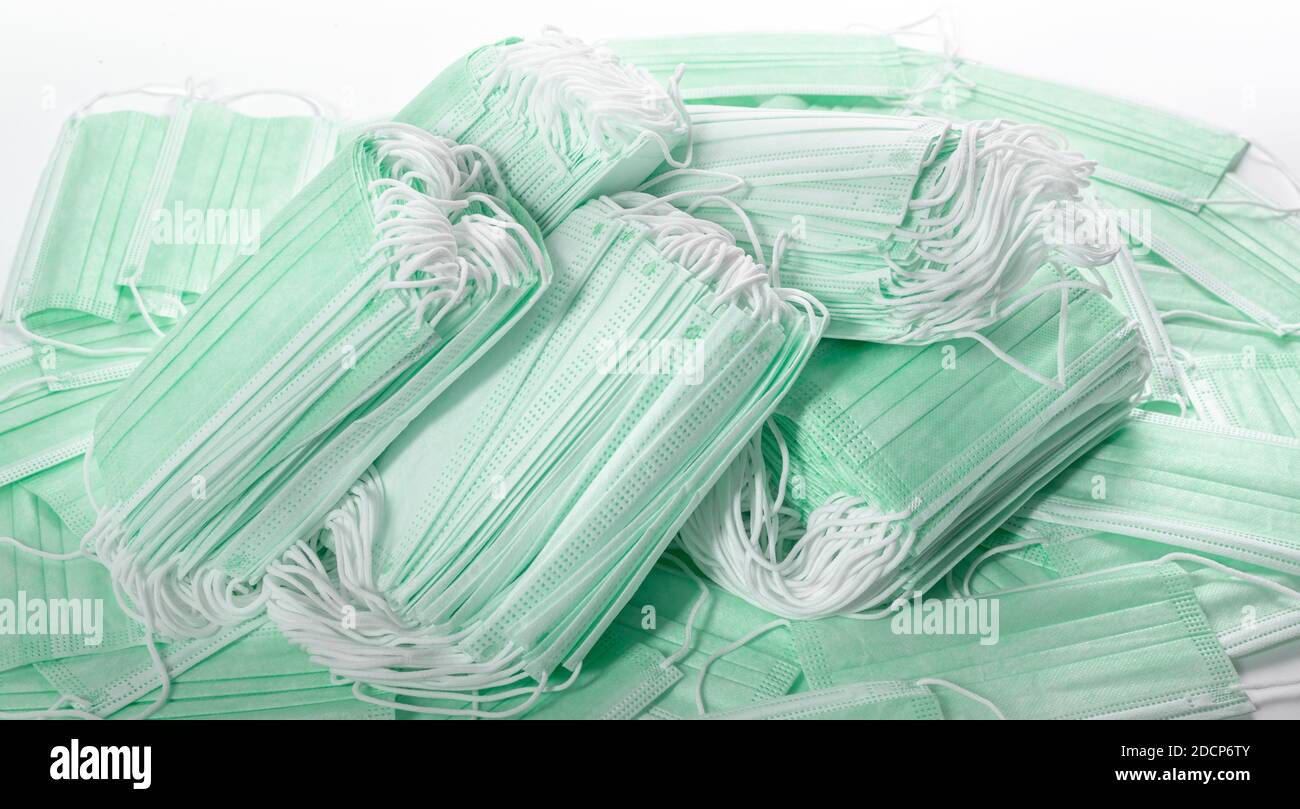 Medical disposable green mask, two stacks on a white background mask ...