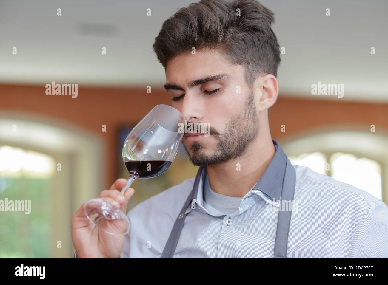 male sommelier is analyzing quality of drink Stock Photo - Alamy
