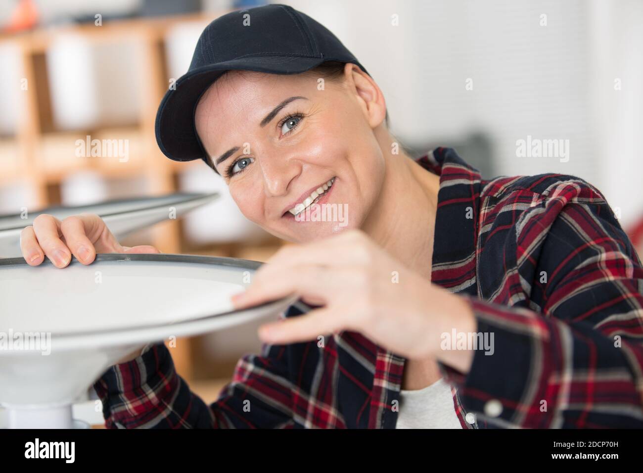 female builder smiling at the camera Stock Photo - Alamy
