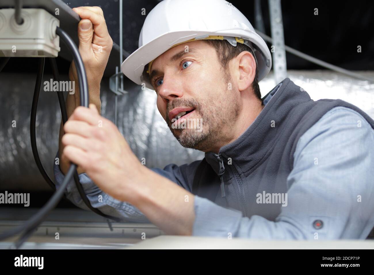 an electrician connecting power cable Stock Photo - Alamy