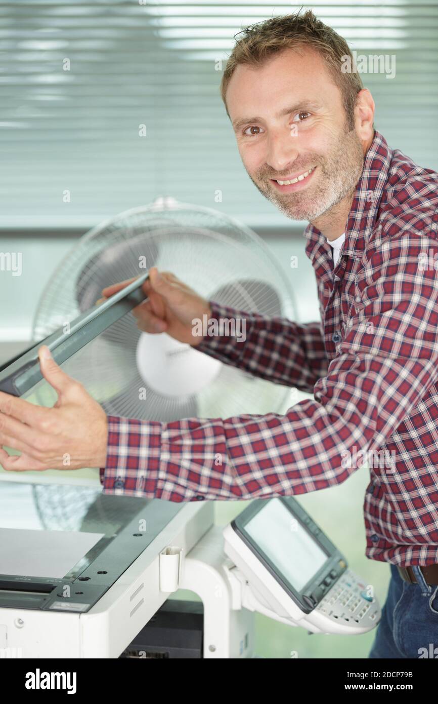 man using scanner multifunction device in office Stock Photo - Alamy