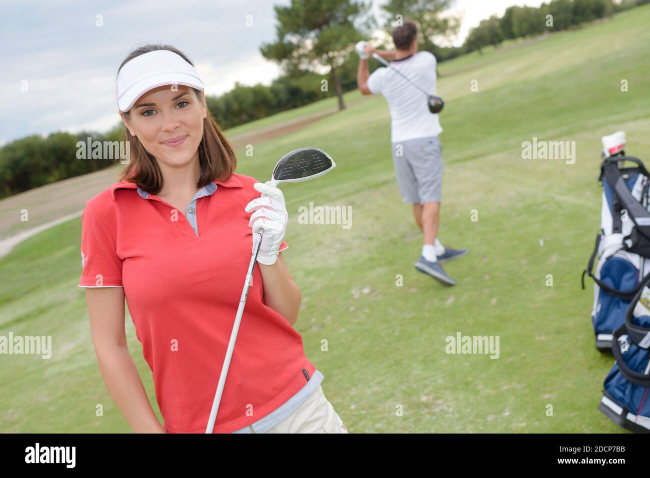 Woman posing on golf course hi-res stock photography and images - Alamy