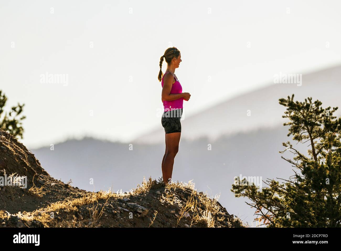 Attractive fit woman paused during run on mountain trails; Salida ...