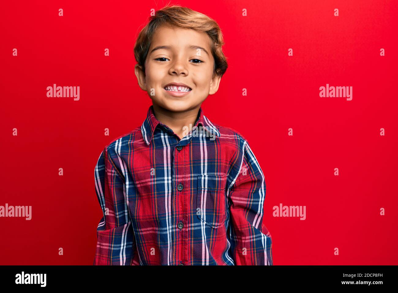 Adorable latin kid wearing casual clothes with a happy and cool smile ...