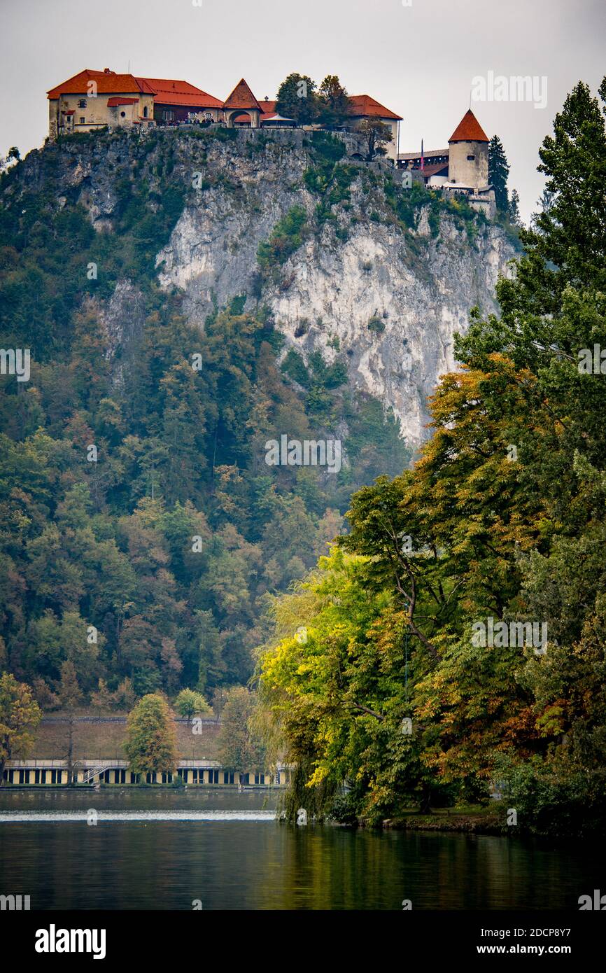 Perched on a rock overlooking Lake Bled is the iconic Bled Castle Stock ...