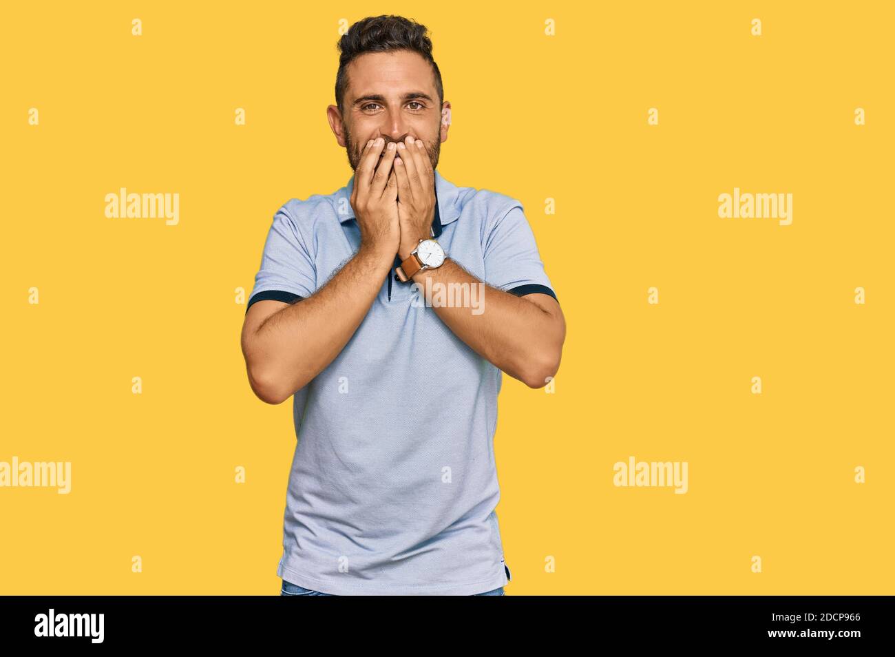 Handsome man with beard wearing casual clothes laughing and embarrassed ...