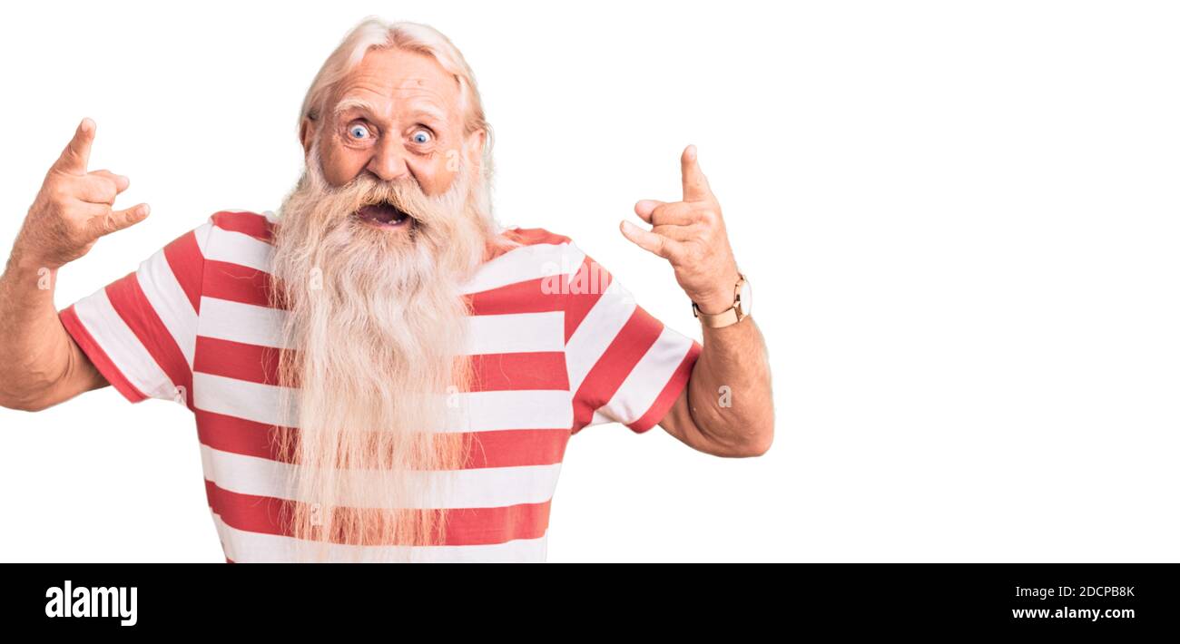 Old senior man with grey hair and long beard wearing striped tshirt ...