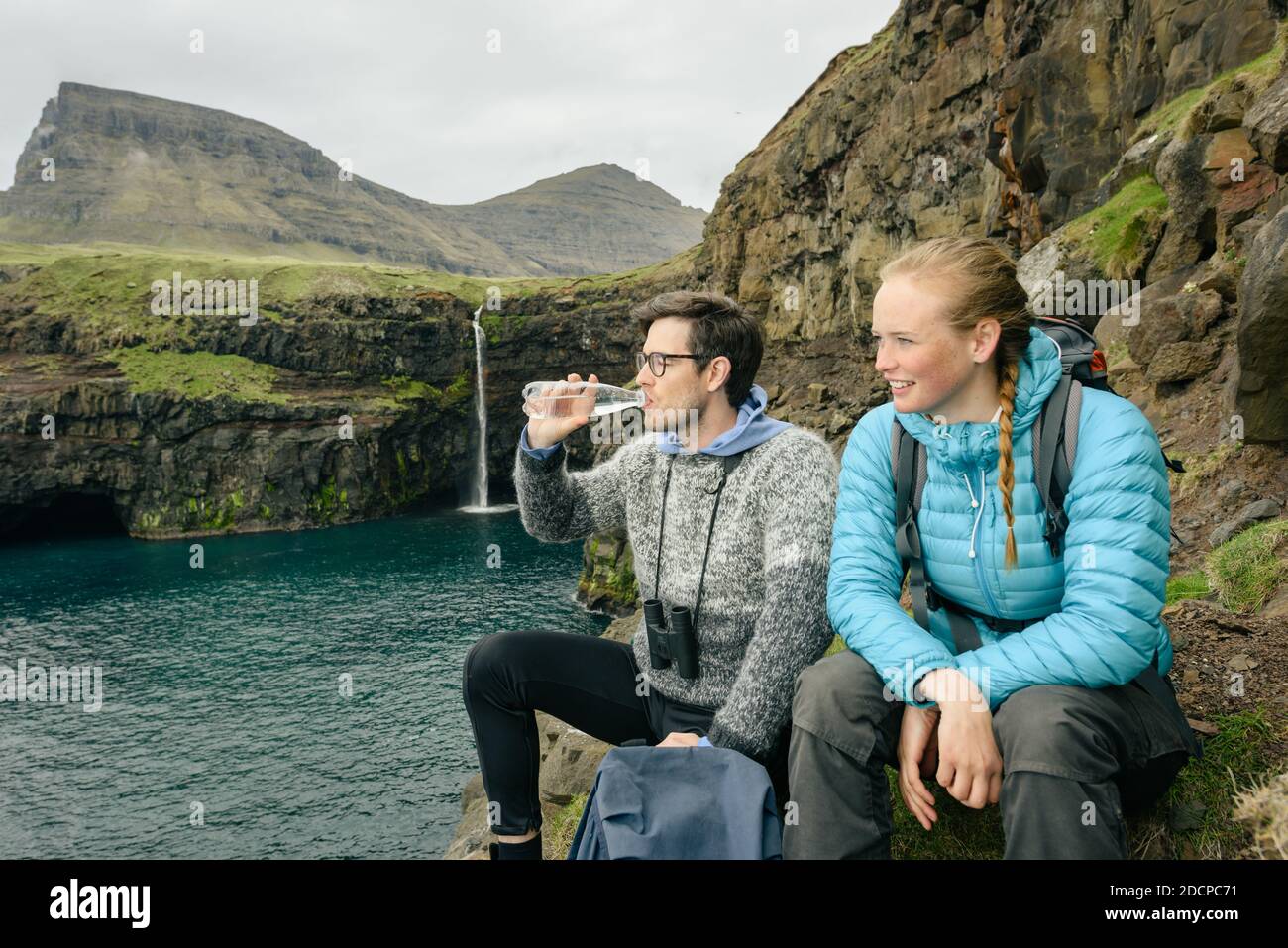 Man drinking water waterfall hi-res stock photography and images - Alamy