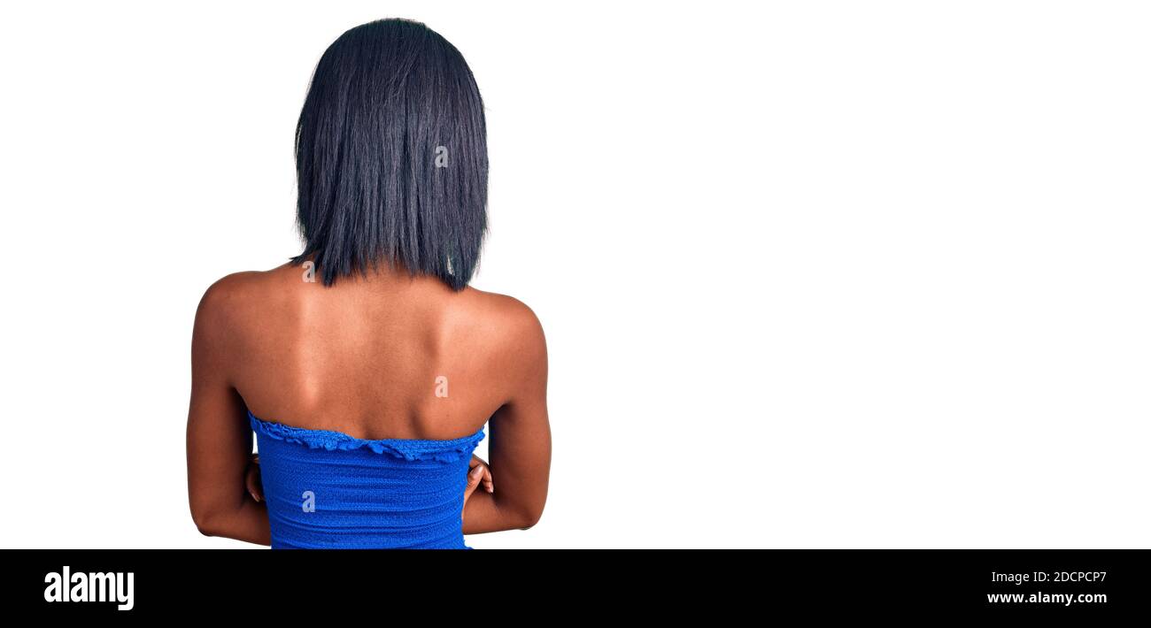 Young african american woman wearing casual summer clothes standing ...