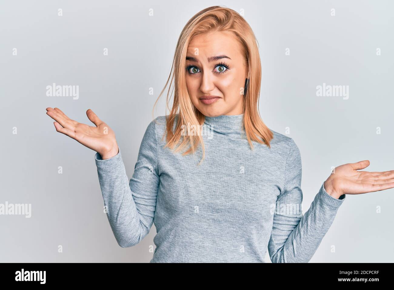 Beautiful caucasian woman wearing casual clothes clueless and confused ...