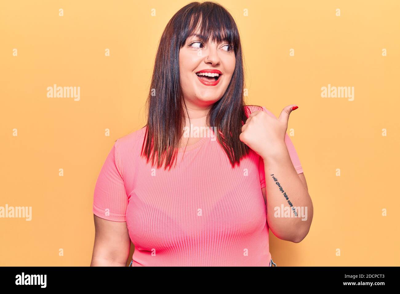Young plus size woman wearing casual clothes smiling with happy face ...