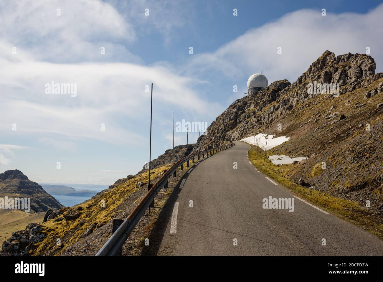 Scenic view of asphalt road going up hill in mountainous terrain on ...