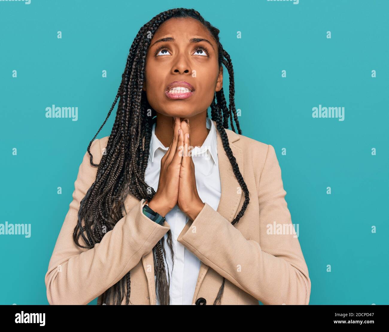 Praying woman suit hi-res stock photography and images - Alamy