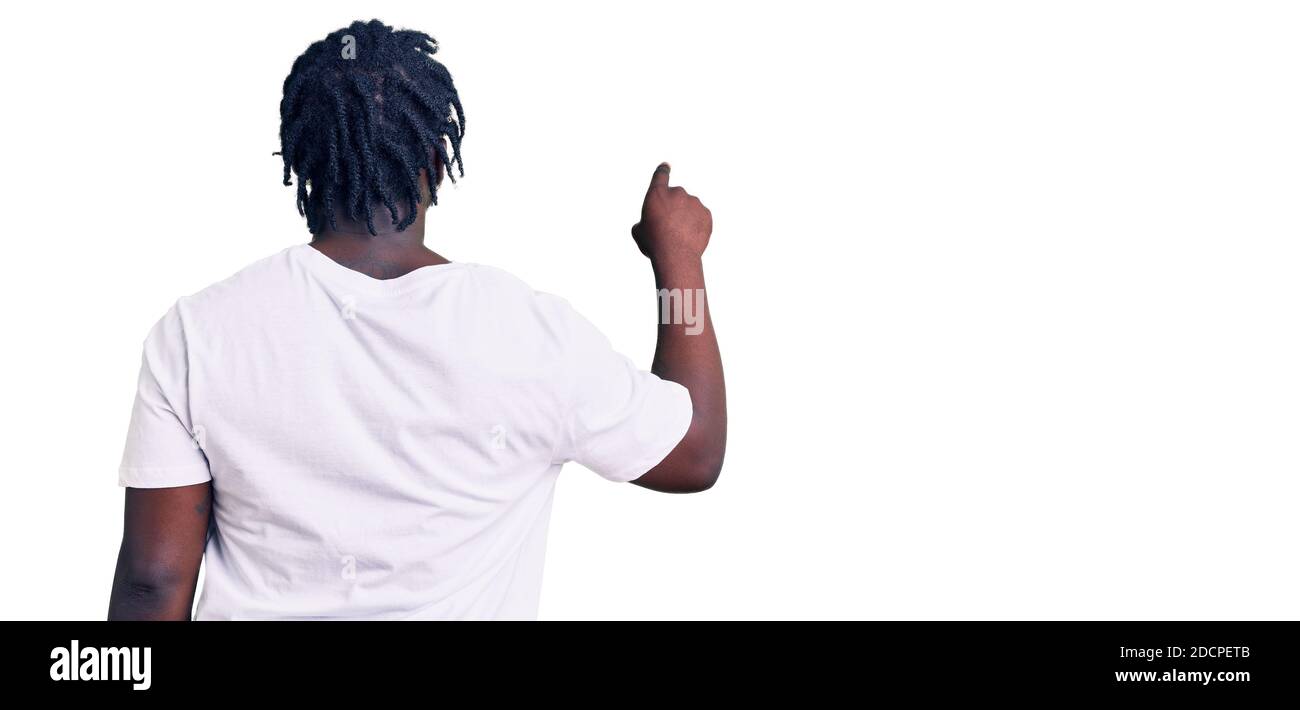 Young african american man with braids wearing casual white tshirt ...