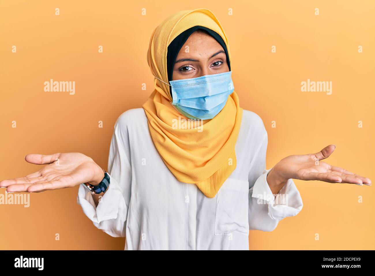 Young brunette arab woman wearing traditional islamic hijab and medical ...