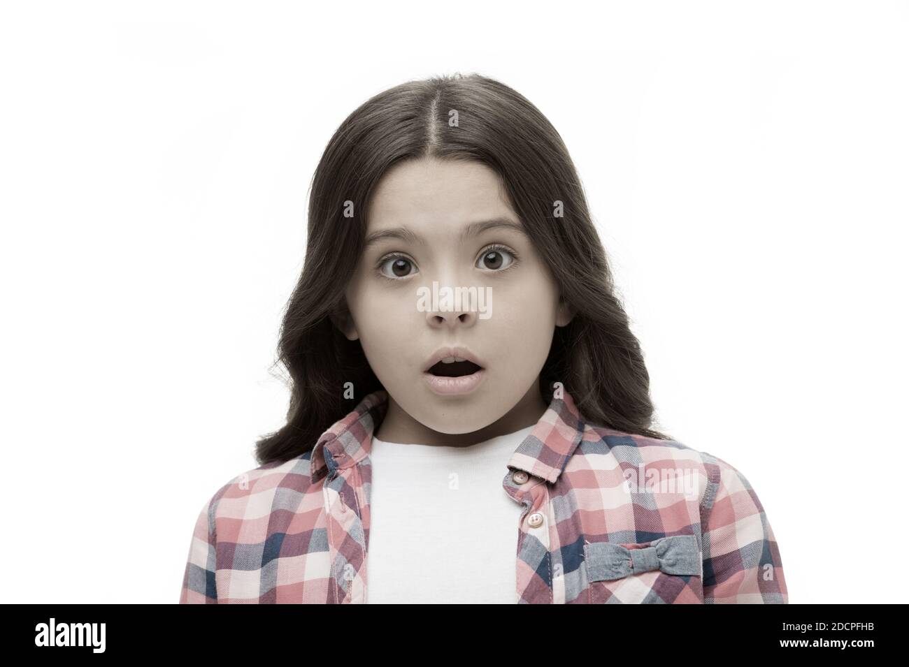 Girl with shocked look isolated on white. Little kid in casual style ...