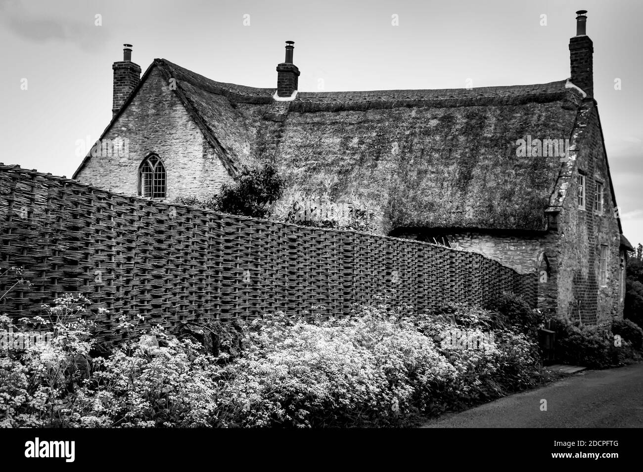 A masterfully woven wattle fence surrounds the garden of a historically ...