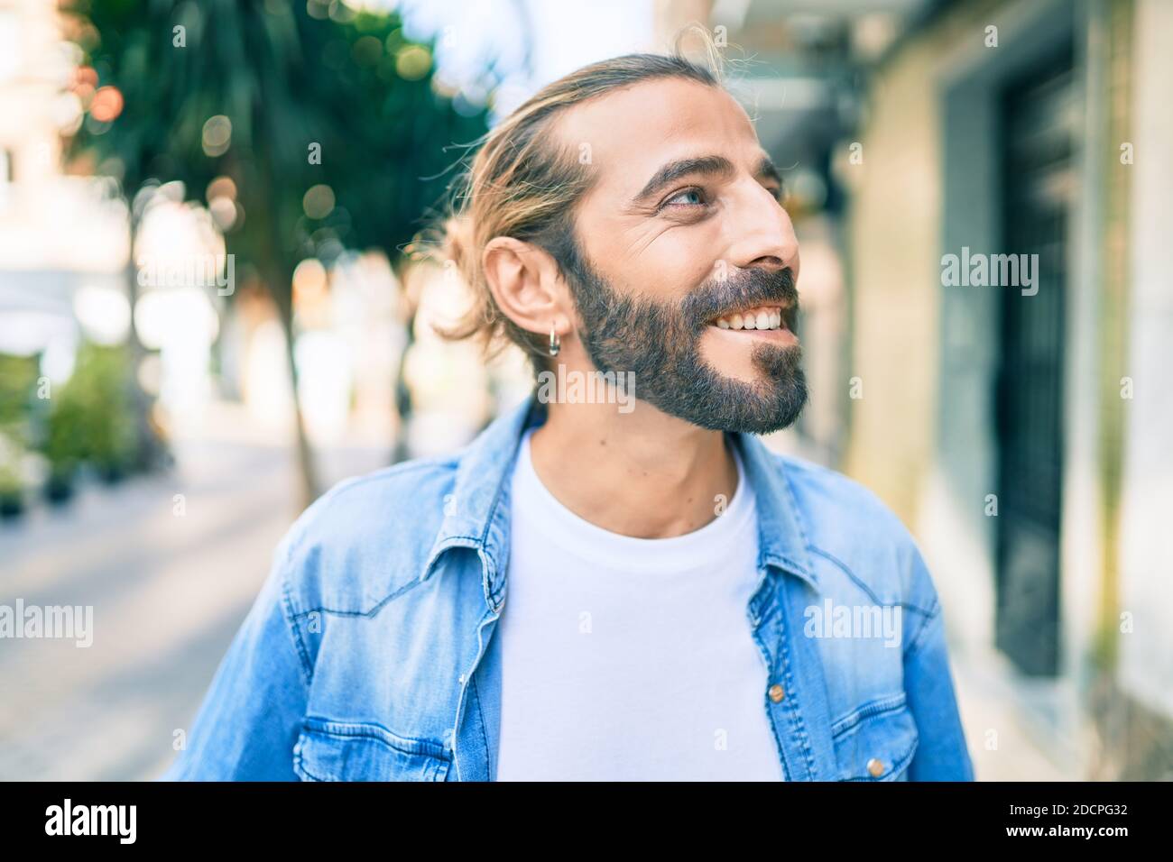 Young middle eastern man smiling happy walking at the city Stock Photo ...