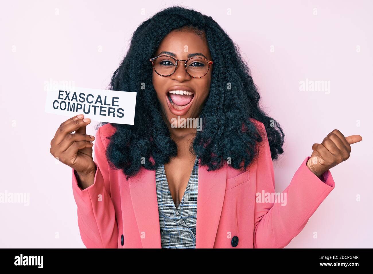 Beautiful african woman holding exascale computers banner pointing ...