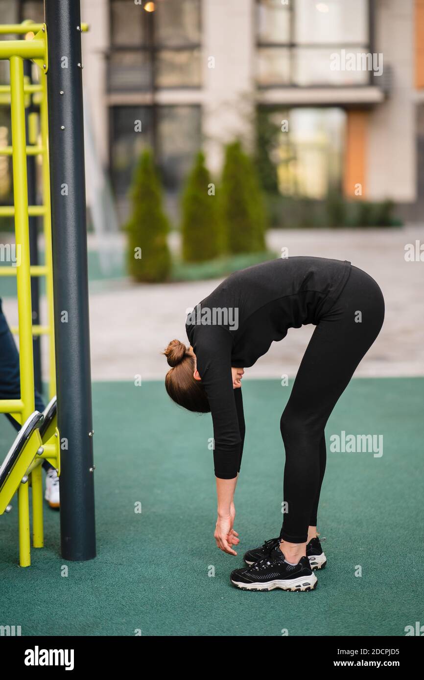Sportswoman stretching muscles making functional training, makes a ...