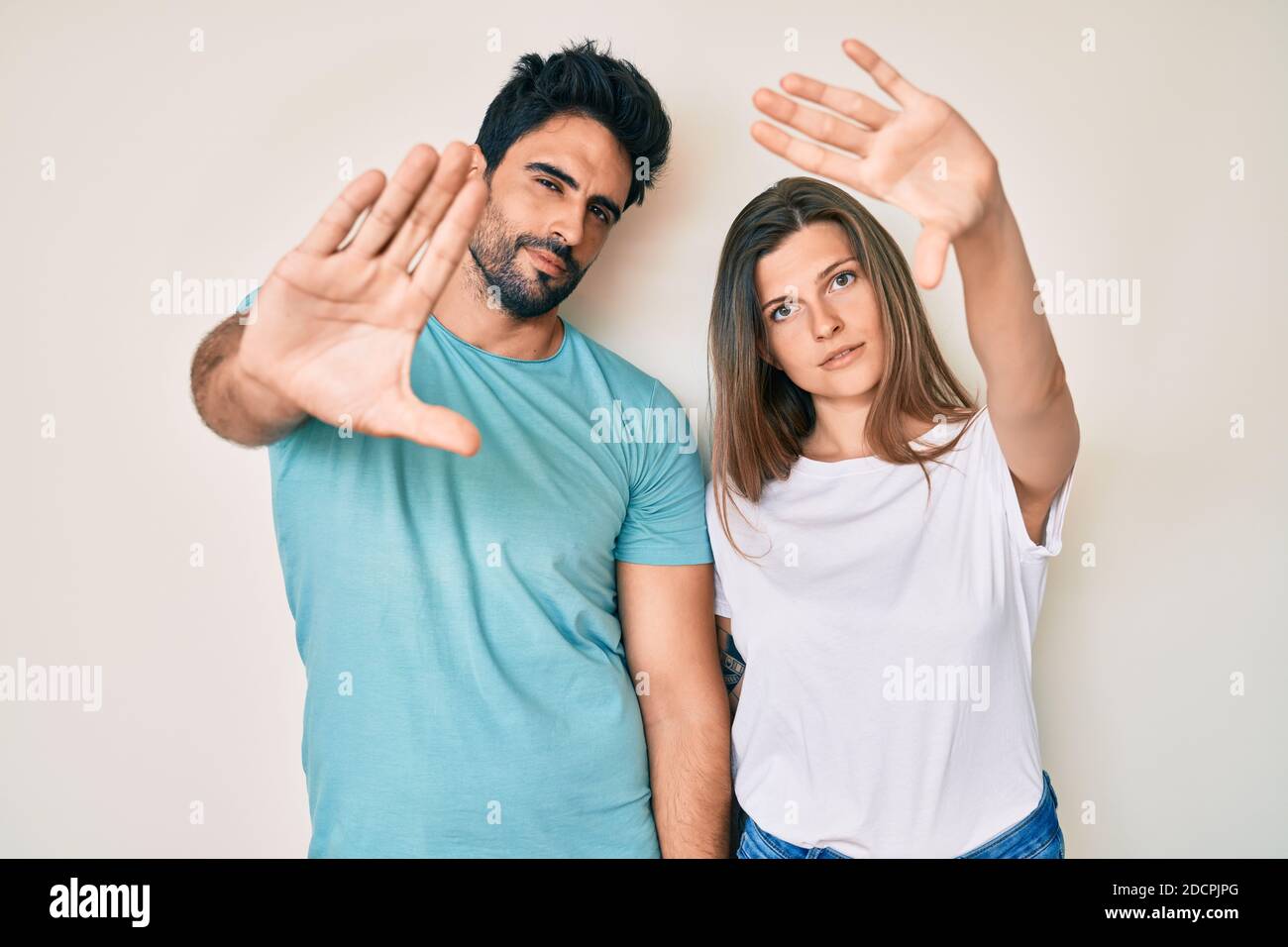 Beautiful young couple of boyfriend and girlfriend together doing frame ...