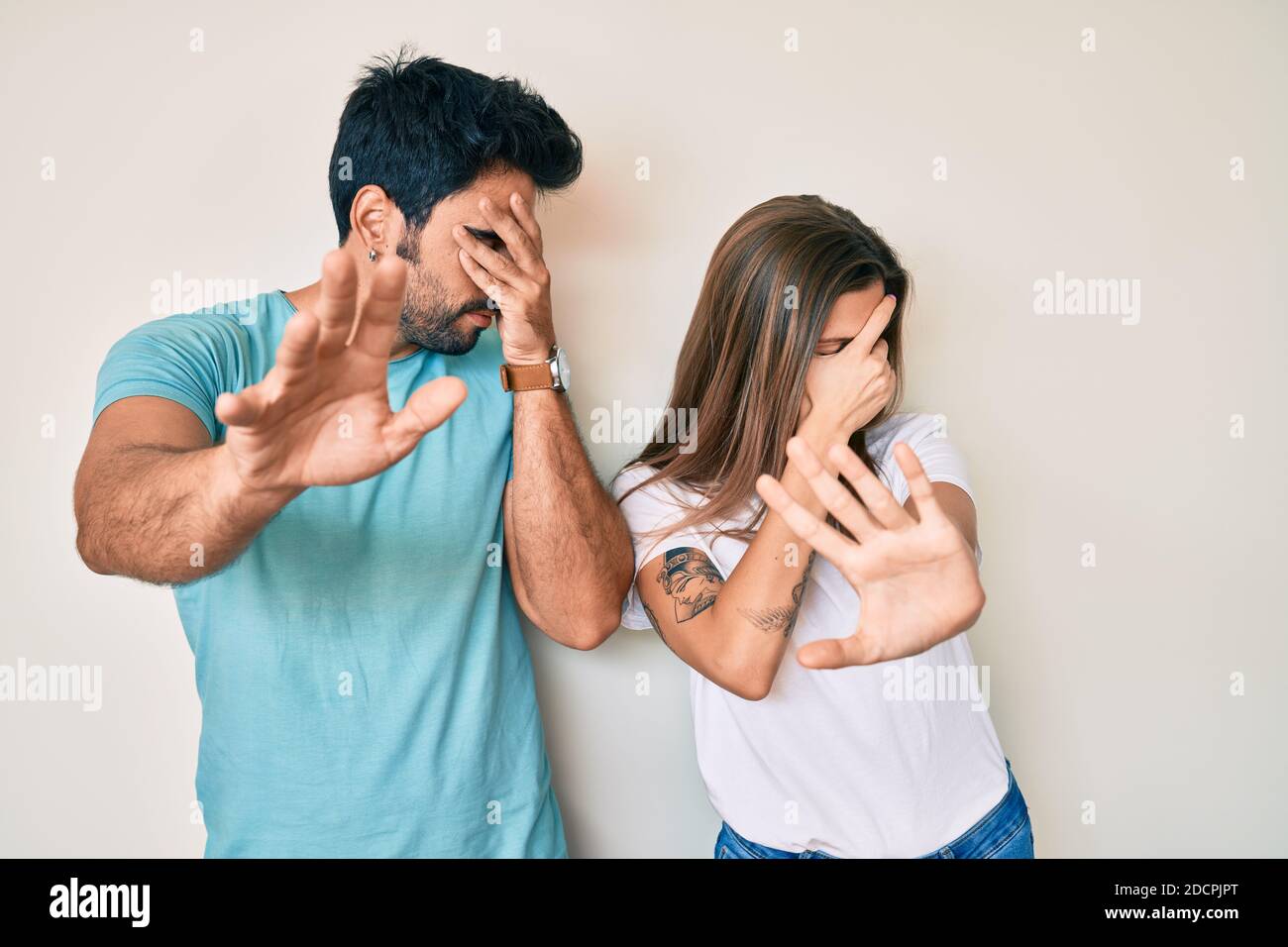 Beautiful young couple of boyfriend and girlfriend together covering ...