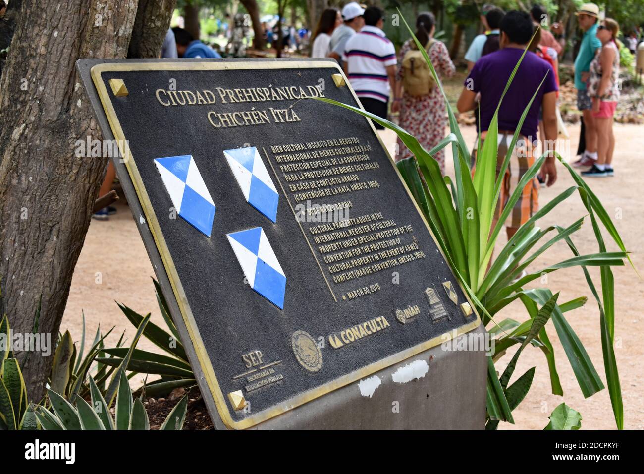 A black and gold sign for the ancient ruins of Chichen Itza on the ...