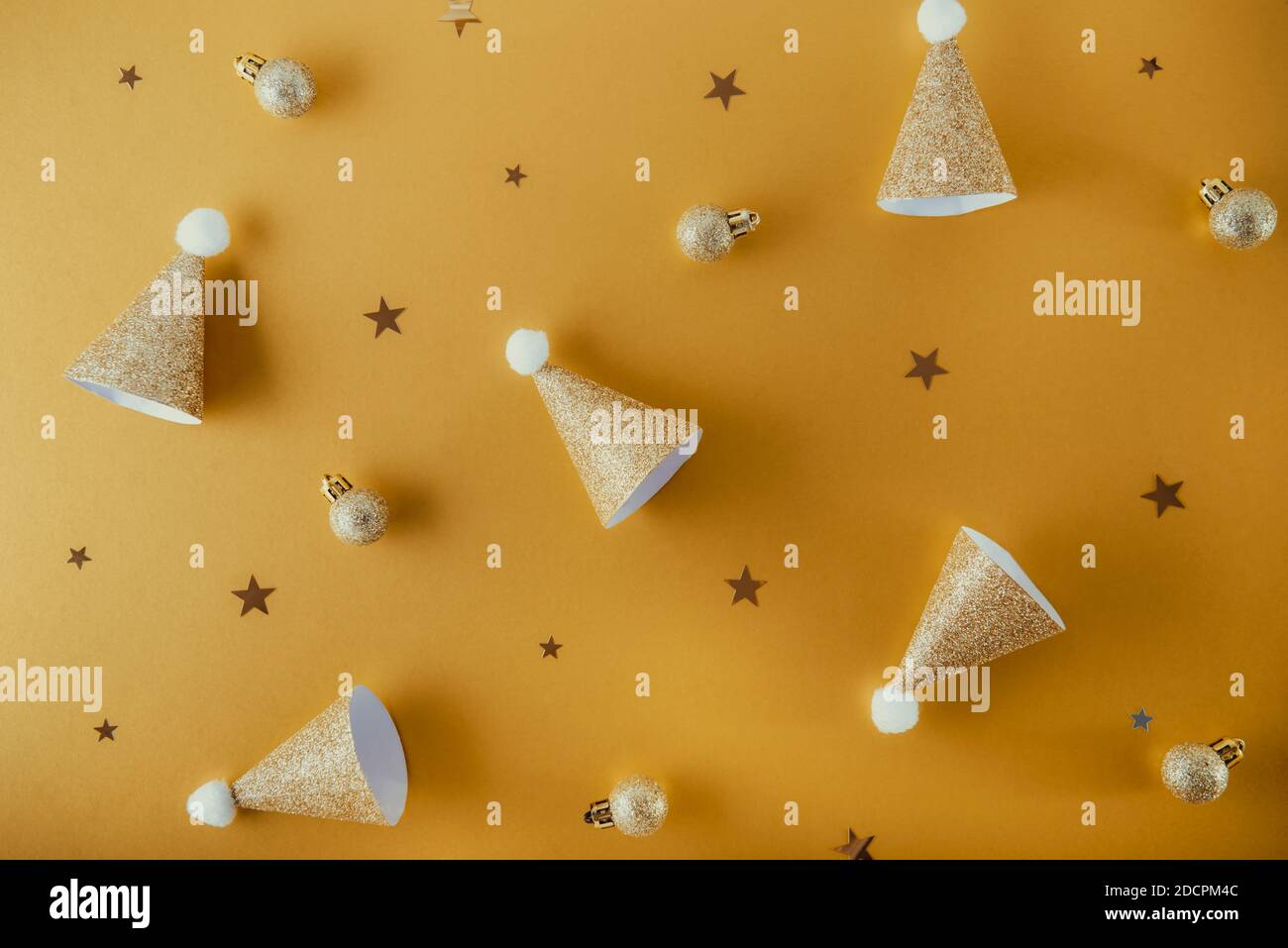 Creative Christmas background in trendy golden color. Festive paper ...