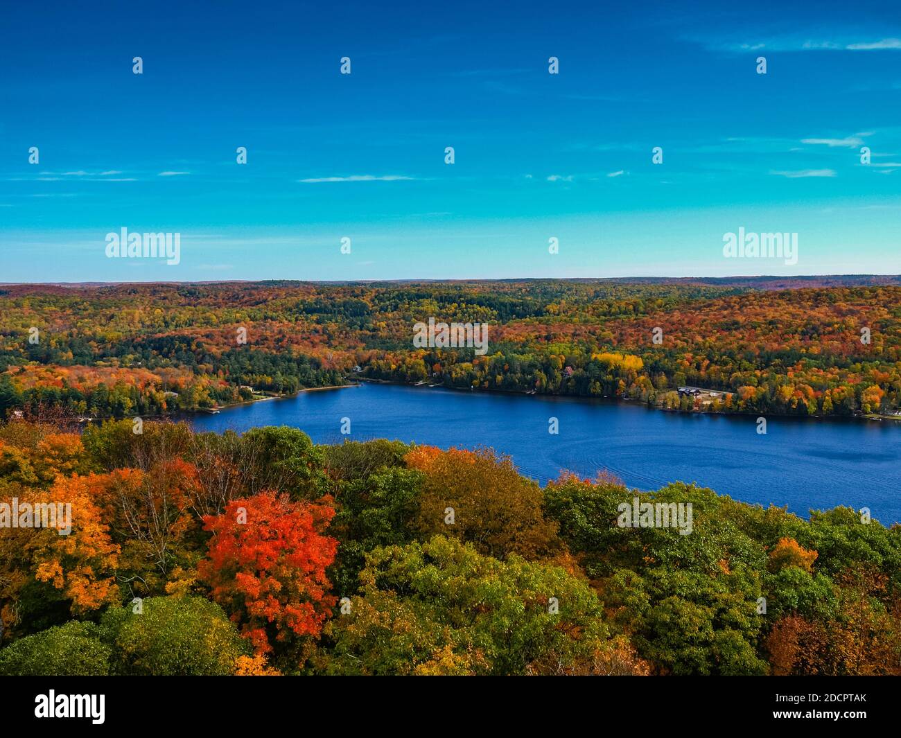 Fall in Ontario is the most beautiful time of the year. Blue lake seen ...