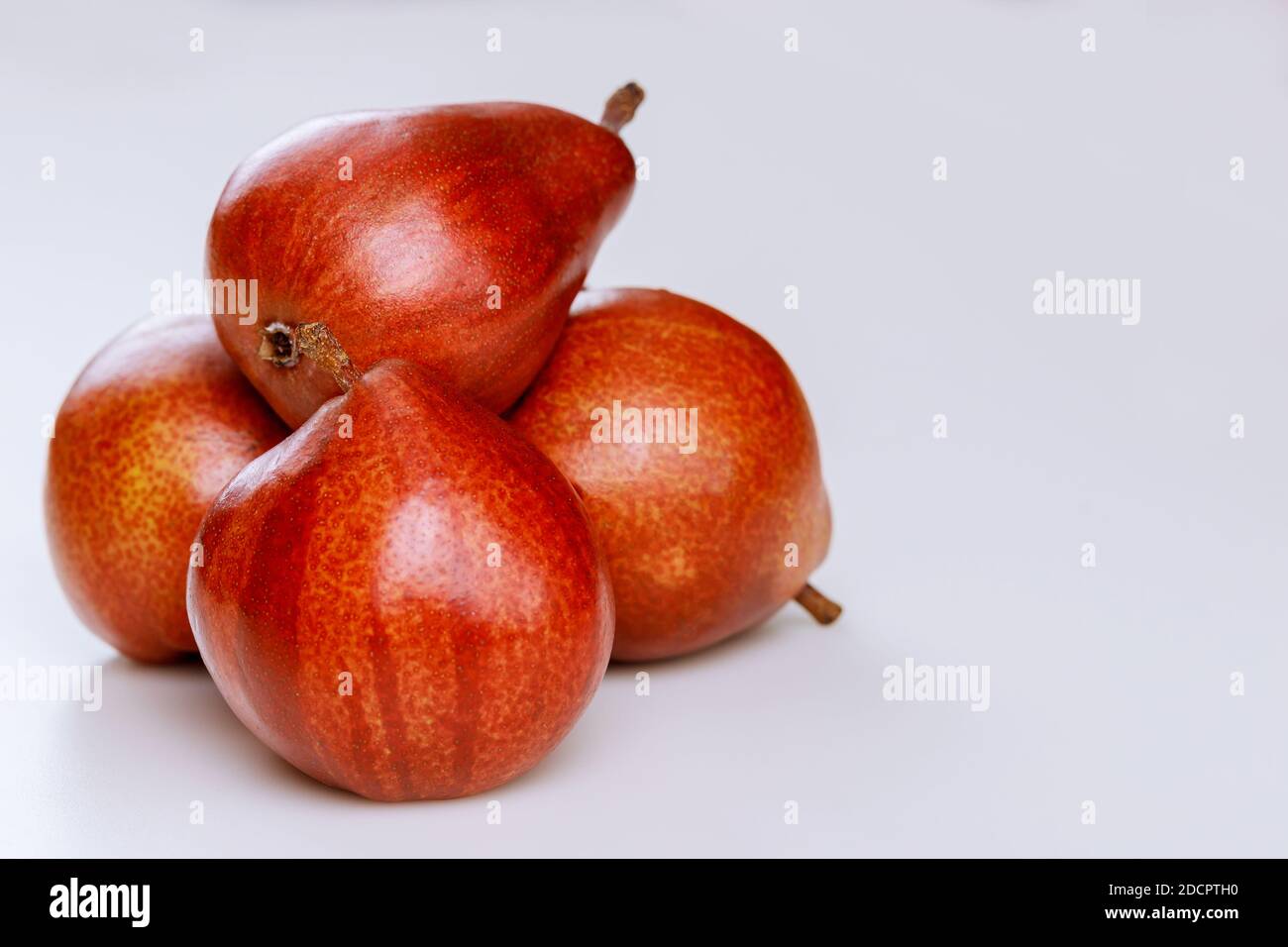 Shiny red pears isolated on white background. Produce product Stock ...