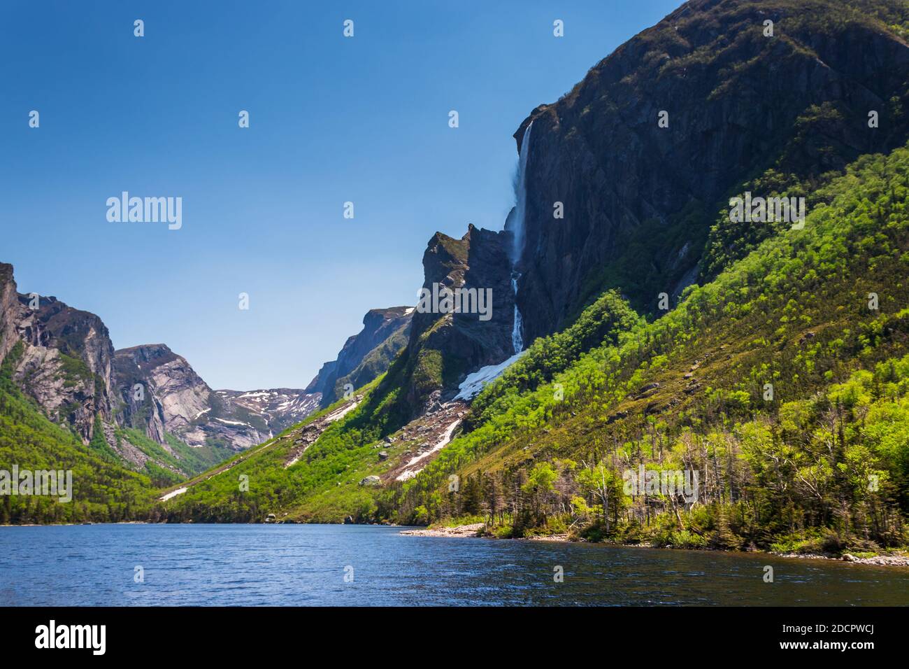 Snow, water, mountains and blue sky - Gros Morne National Park ...