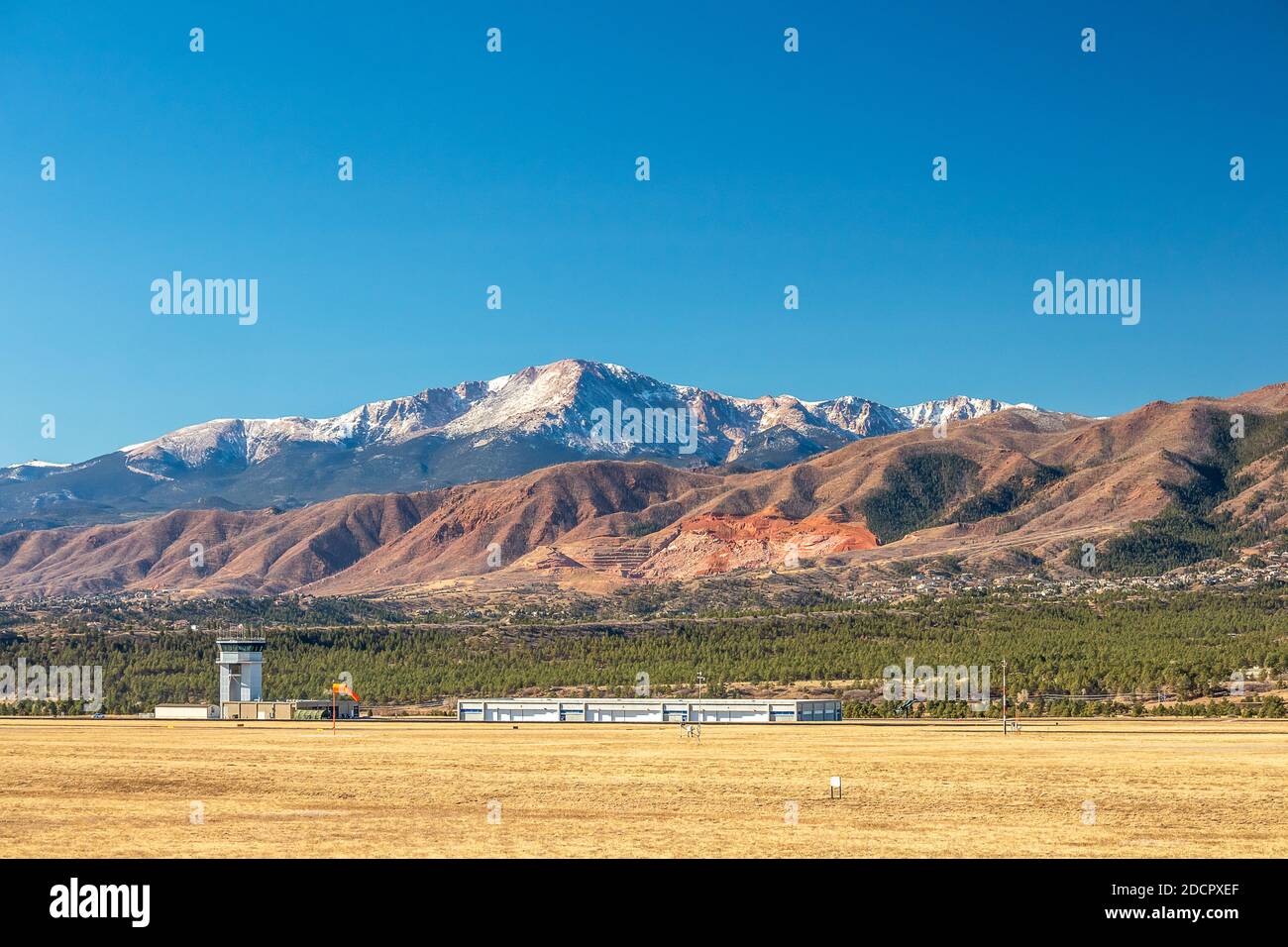 Panoramic view of Pikes Peak with air traffic control tower and rock ...