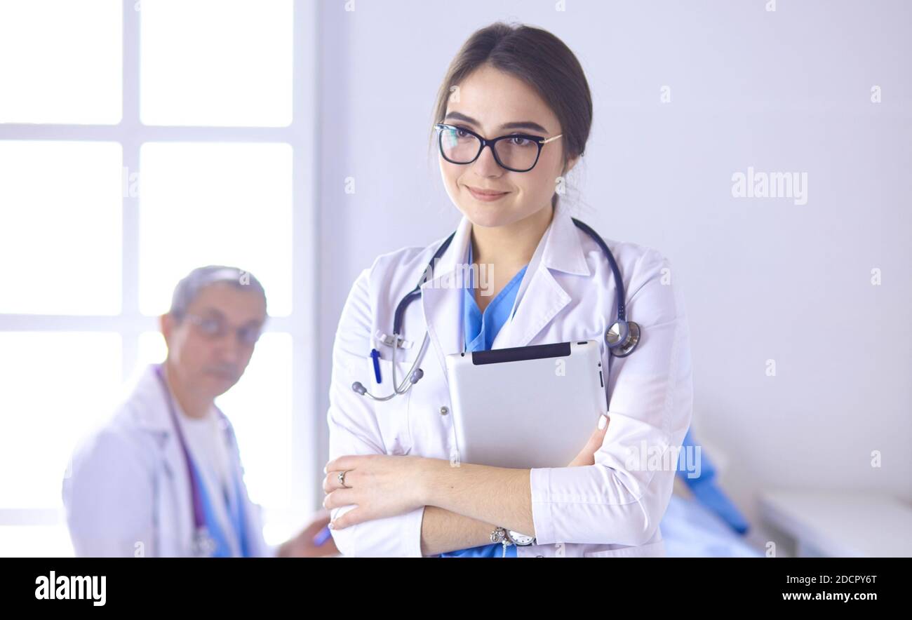 Doctor checking heart beat of patient in bed with stethoscope Stock ...
