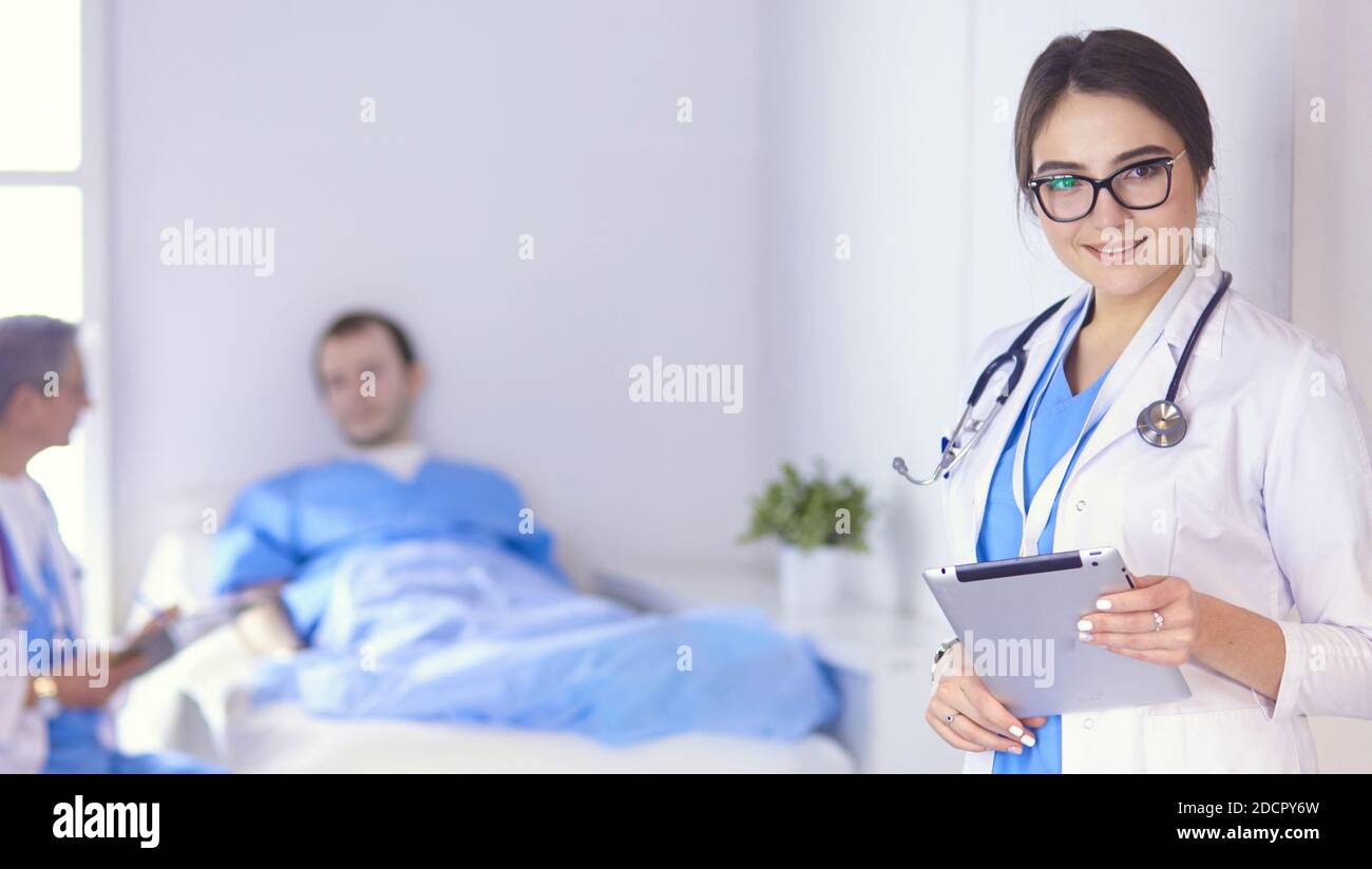 Doctor checking heart beat of patient in bed with stethoscope Stock ...