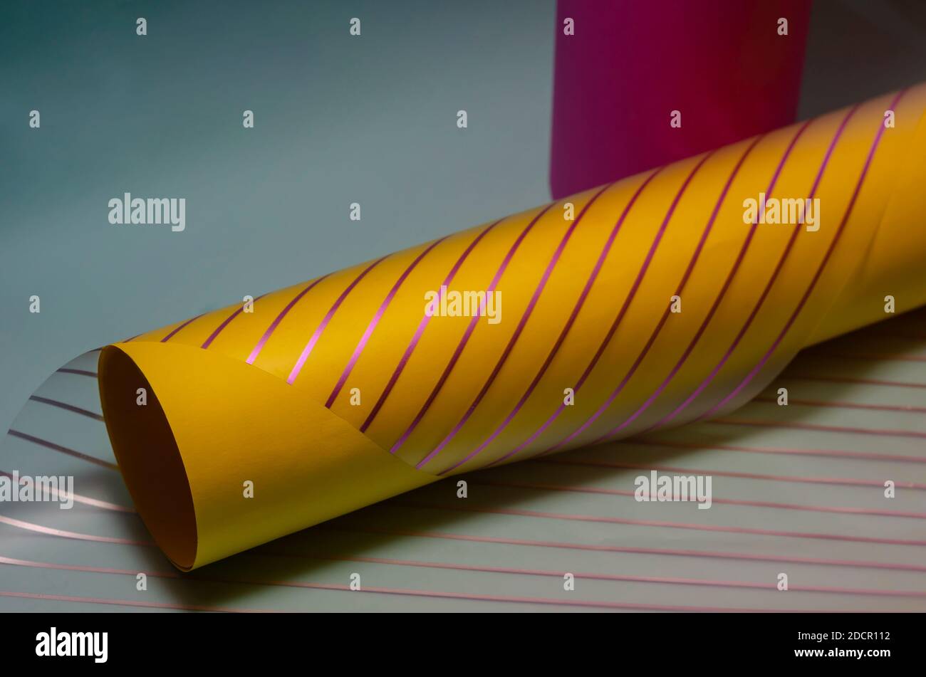 Creative abstract purple and yellow composition on a light blue ...