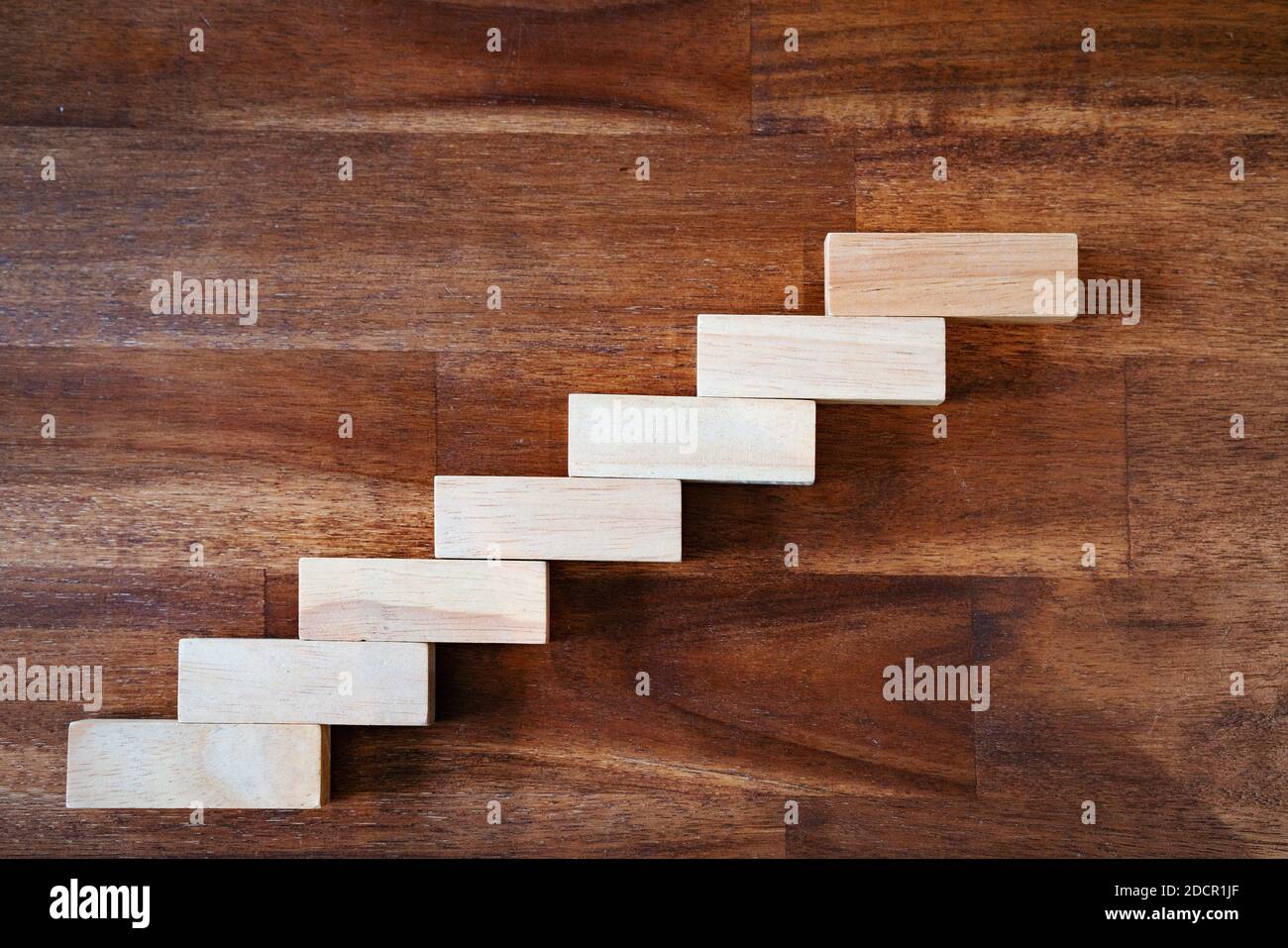 Wooden block stacking as step staircase. Business concept for growth ...